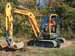 Learn about compact excavator grade control systems