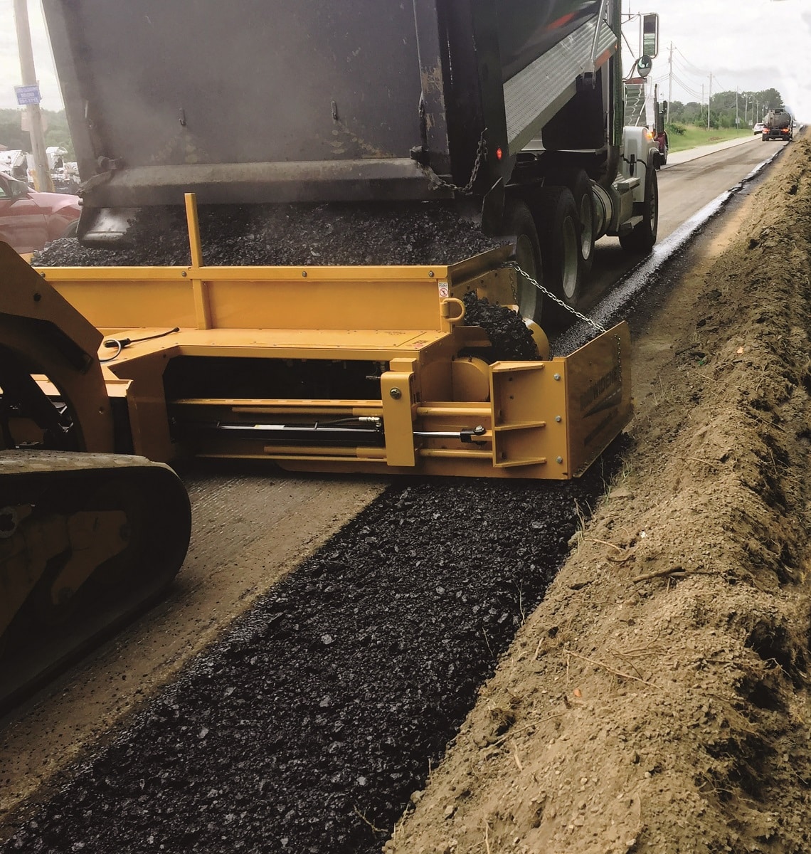 Road Widener’s FH-R Material Placement Attachment Reduces Labor by 50 ...